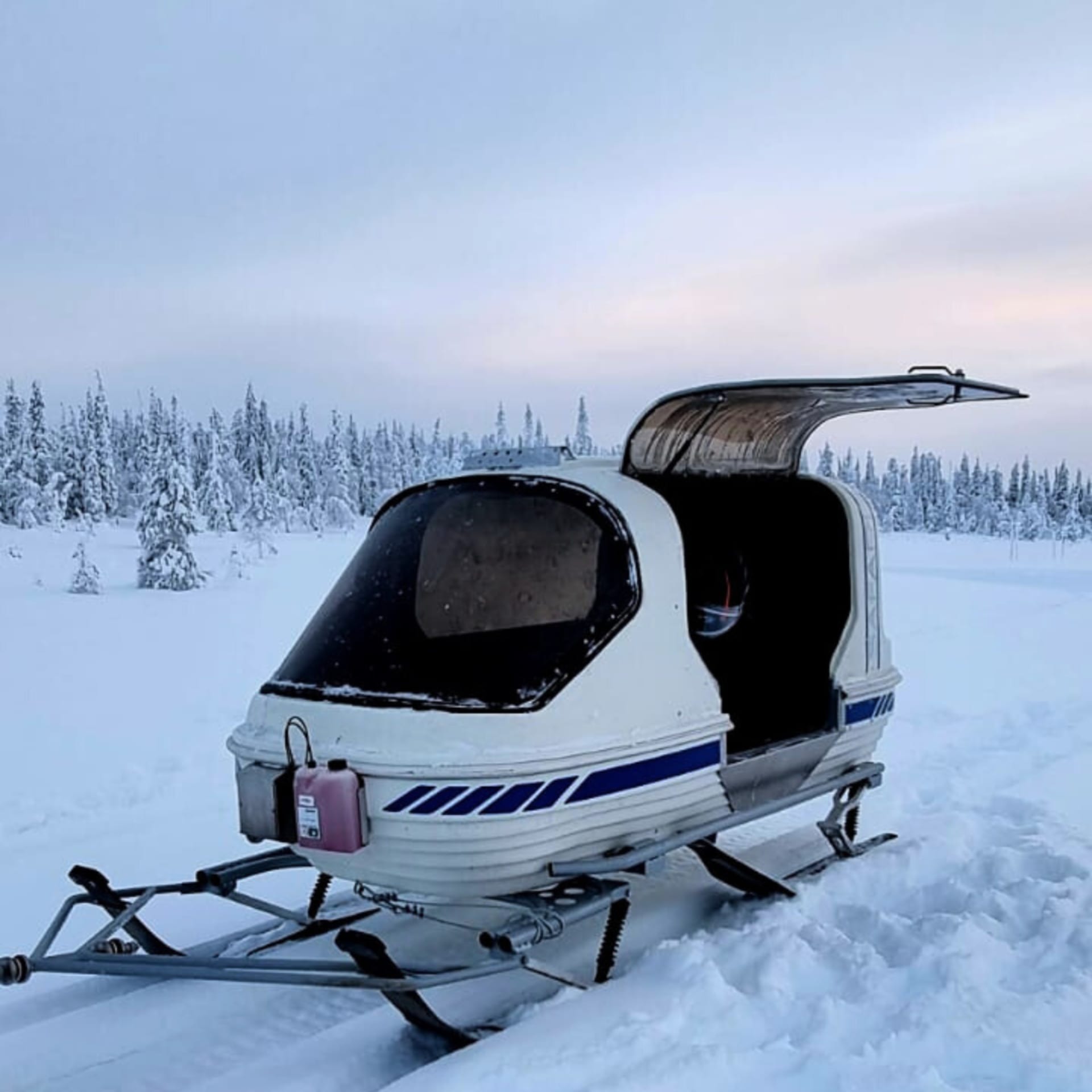 Shuttle Safari passenger sleigh for snowmobile | Visit Finland