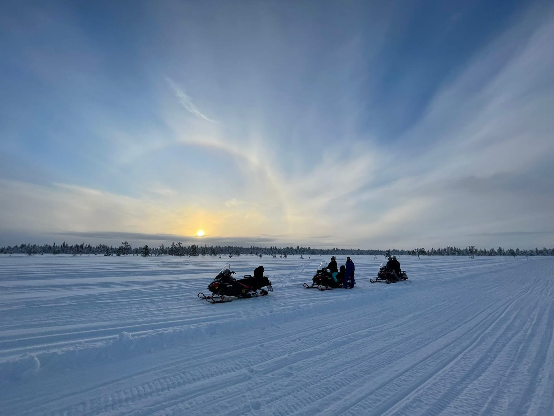 Snowmobile safari to the forest kota in Ylläs with a local family ...