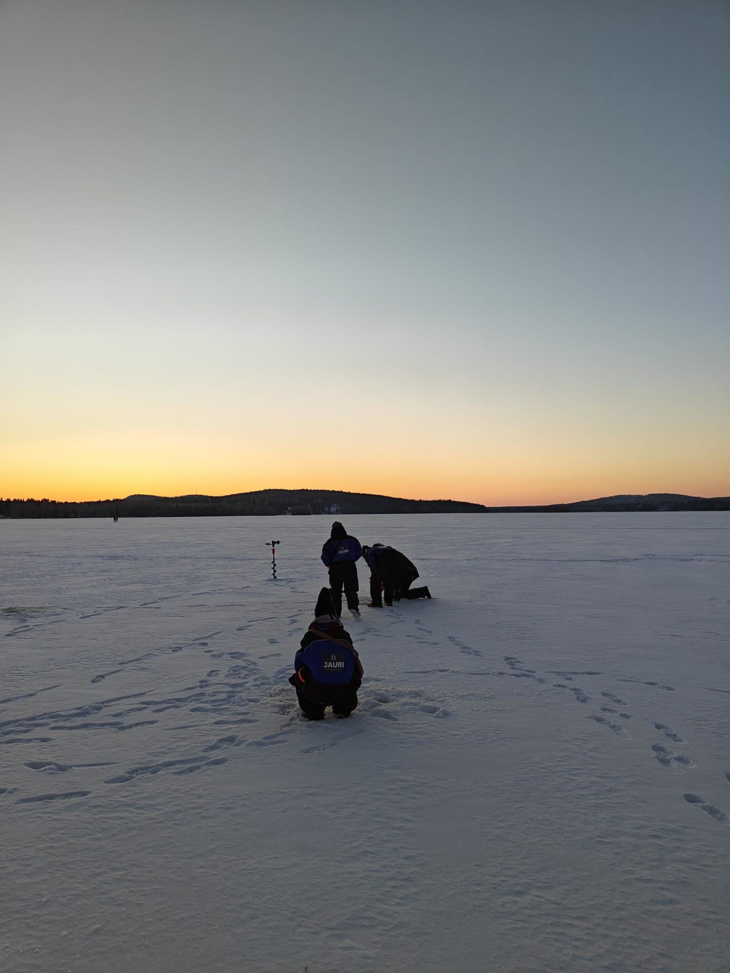 Ice fishing by Jauri Resort | Visit Finland